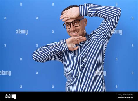 Hispanic Man With Beard Wearing Glasses Smiling Cheerful Playing Peek A
