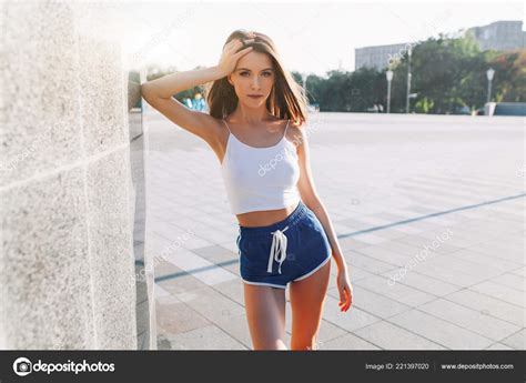 Beautiful Young Sexy Girl Athlete Resting After A Hard Athletic Workout