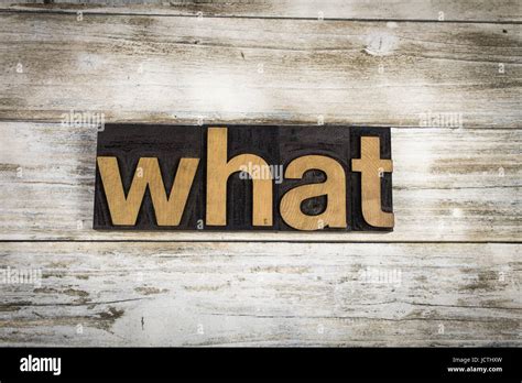 The Word What Written In Wooden Letterpress Type On A White Washed