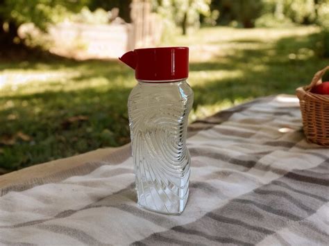 Vintage Covetro Clear Glass Ribbed Wave Carafe With Red Plastic Lid