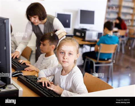 Preteen Girl Studying In Computer Class Stock Photo Alamy