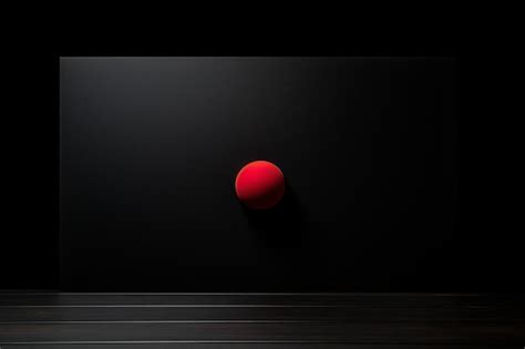 Premium Ai Image A Red Ball On A Black Background With A Black