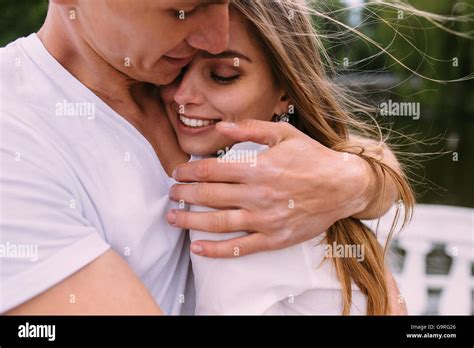 Guy Hugging His Girlfriend Stock Photo Alamy