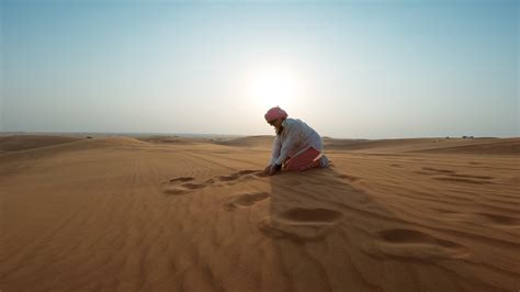Woman Throws Desert Sand Into The Air Stock Video At Vecteezy