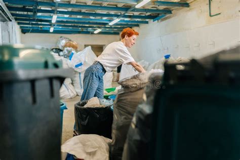 Wide Shot Of Focused Female Volunteer Worker In Latex Gloves Sorting