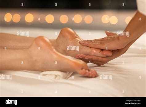 Relaxing Foot Massage At Serene Spa With Warm Ambient Lighting Stock