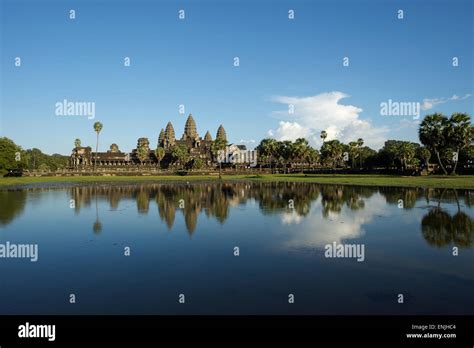Ancient Temple Complex Of Angkor Wat Reflecting In Still Water Under