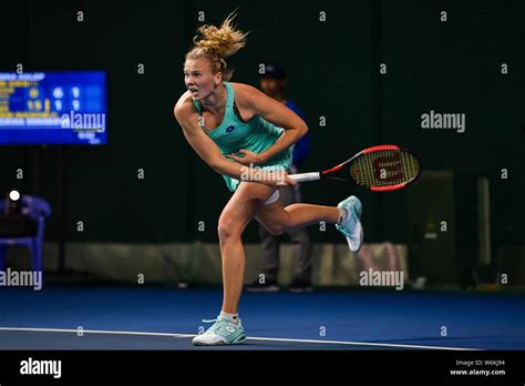 Katerina Siniakova Of Czech Republic Serves Against Simona Halep Of