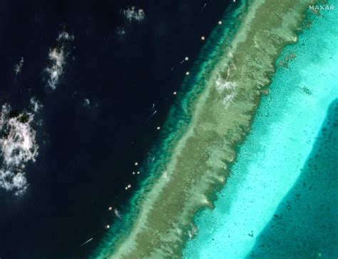 Exclusive Satellite Images Reveal Floating Barrier At Mouth Of Disputed Atoll In South China Sea