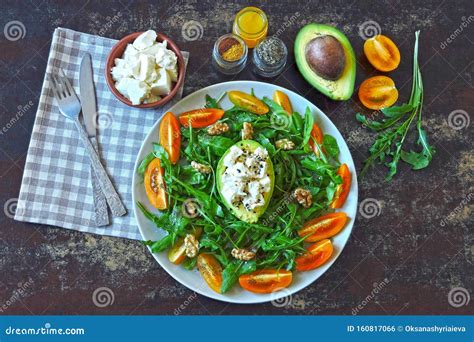 Healthy Fitness Salad With Arugula Avocado Feta And Yellow Cherry