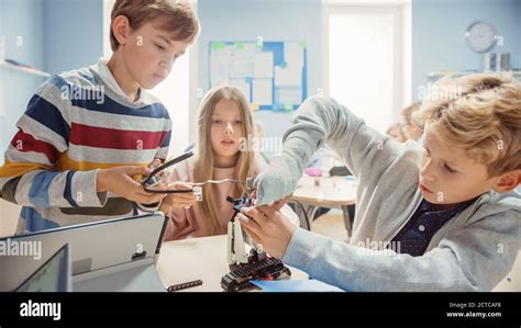 Elementary School Robotics Classroom Diverse Group Of Brilliant