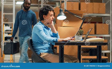 Man And Woman Checking Inventory And Stock Before Shipping Merchandise Order Stock Photo Image