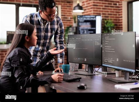Diverse Team Of System Engineers Developing Html Code And Cloud Computing In It Development