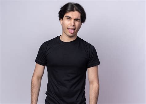 Free Photo Joyful Young Handsome Guy Wearing Black T Shirt Showing