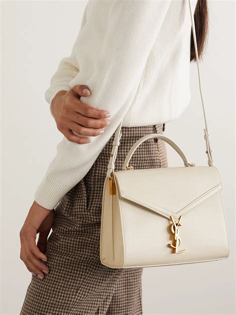 Cassandra Medium Top Handle Bag In Grain De Poudre Embossed Leather