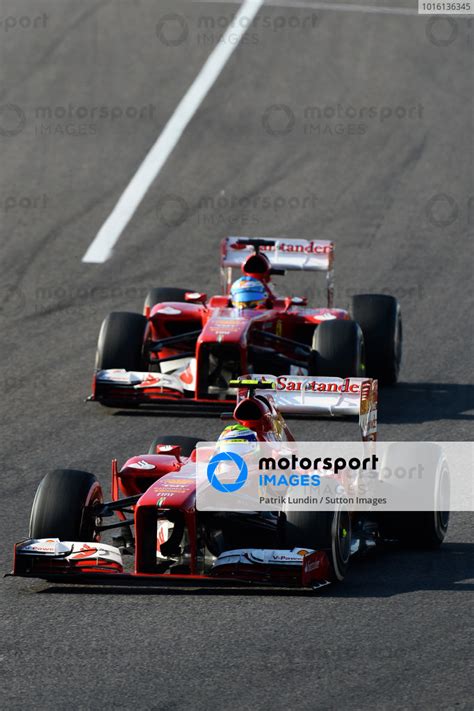 Felipe Massa (BRA) Ferrari F138 leads Fernando Alonso (ESP) Ferrari ...