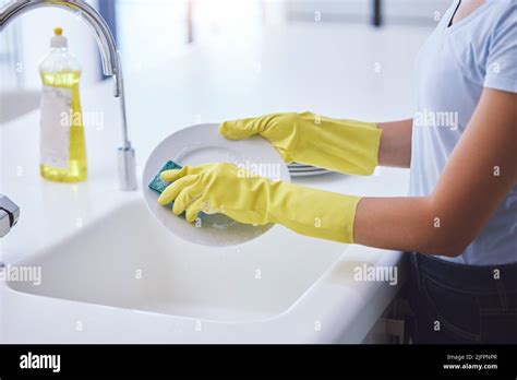 There Will Always Be A Plate To Clean Shot Of An Unrecognizable Woman