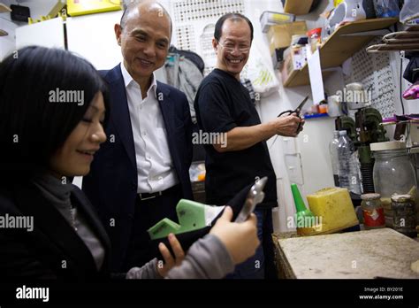 Fashion Designer Jimmy Choo Oversees Work On A Pair Of Bespoke Shoes In