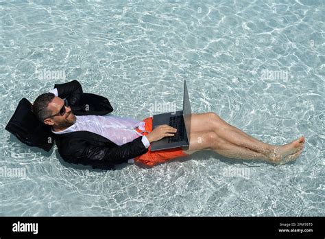 Successful Businessman In Suit In Pool Water Summer Vacations And