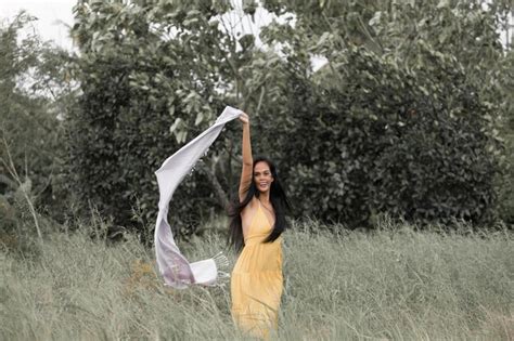 Premium Photo Brunette Girl Wearing A Yellow Dress In The Nature
