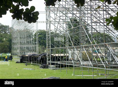 Different Parts Of Metal Scaffold On The Construction Field Workers Build A Concert Stage