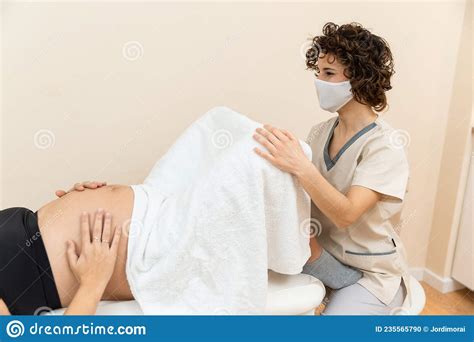 Gynecologist Examining And Performing Pelvic Floor Treatment On