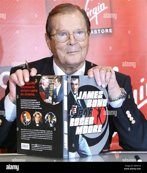 Roger Moore Attends A Signing Session For His New Book James Bond Par