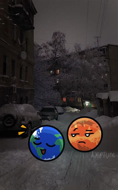 An Image Of Two Earth Faces In The Snow At Night With Buildings And