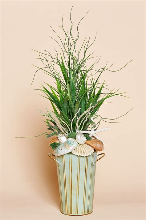 Aqua Tin Arrangement With Grasses And Shells Beach Arrangements Flower