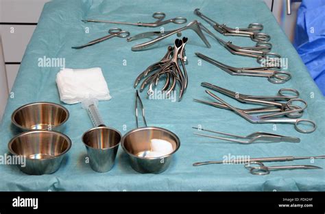 A Nurse Perpares Instruments For An Operation In An Ultramodern