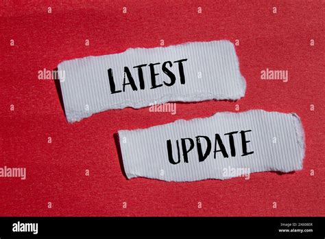 Latest Update Words Written On Ripped White Paper Pieces With Red