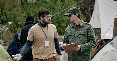 Male Volunteer And Representative Of Migration Support Service