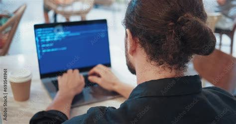 Coffee Shop Coding Concept A Programmer Sitting In A Bustling Coffee