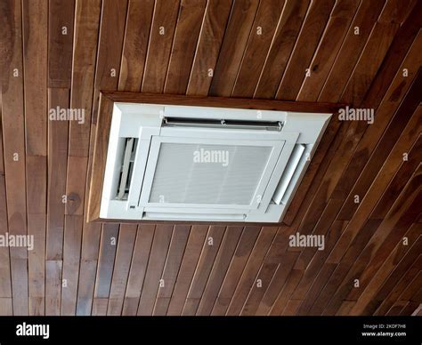 Ceiling Mounted Cassette Type Air Conditioner System On Wooden Ceiling