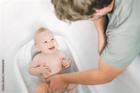 Cute Newborn Baby Girl Having Fun While Taking A Bath Father Daughter Time Stock Photo Adobe