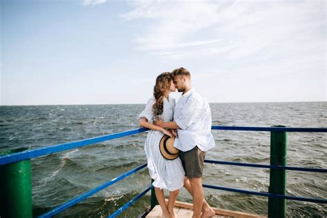 Young Happy Couple Kissing On The Sea Pier Stock Image Image Of