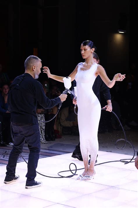 Bella Hadid Had Her Futuristic Coperni Slip Dress Spray Painted On Live