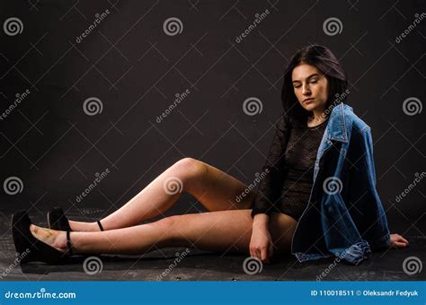 Young Beautiful Girl Naked Isolated On A Black Background Stock Image