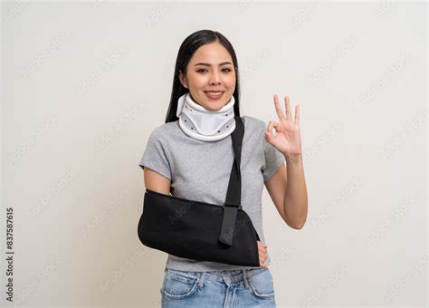 Happy Young Asian Woman Broken Arm On Isolated Background Asian Female