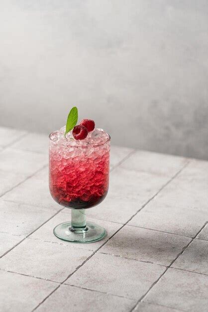 Premium Photo Glass Of Bright Pink Raspberry Drink With Crushed Ice