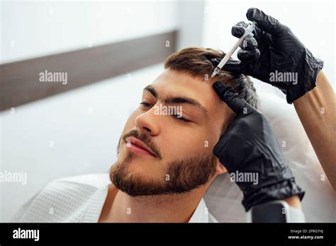 Beauty Injections Female Cosmetologist In Transparent Gloves Makes An Injection In The Lower