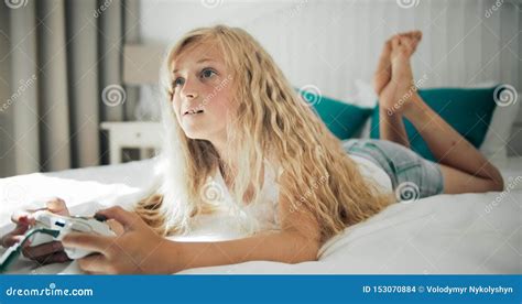 Girl Playing Video Game In Bed Stock Footage Video Of Relaxation