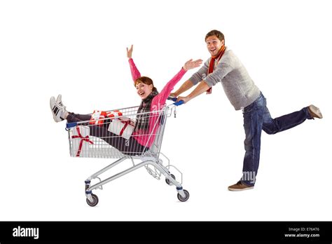 Man Pushing Woman In Trolley Stock Photo Alamy