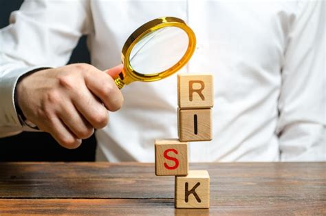Premium Photo A Man Explores A Tower Of Cubes With The Word Risk Search And Correction Of