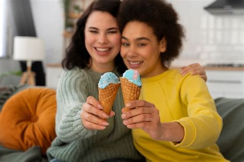 Premium Photo Medium Shot Friends Eating Tasty Ice Cream