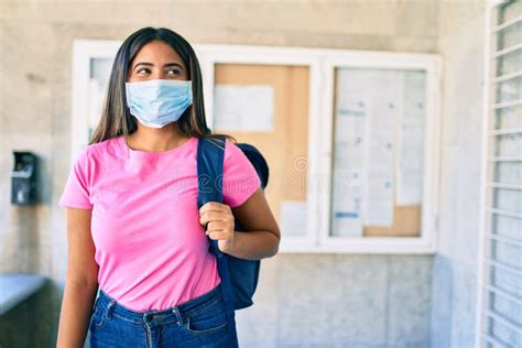 Young Latin Student Girl Wearing Medical Mask At University Campus