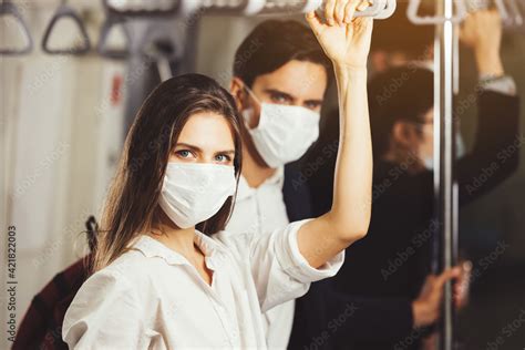People On The Train Wear Anti Virus Masks And Travel During Rush Hours