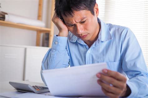 Business Men Are Worried About The Documents Or Bills They Hold In