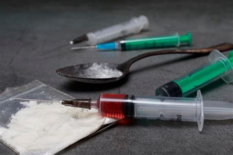 Premium Photo Syringe For Injection With Narcotic Drugs The Concept