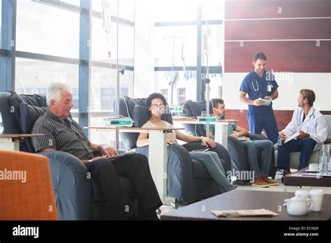 Patients Undergoing Medical Treatment With Doctors Discussing In